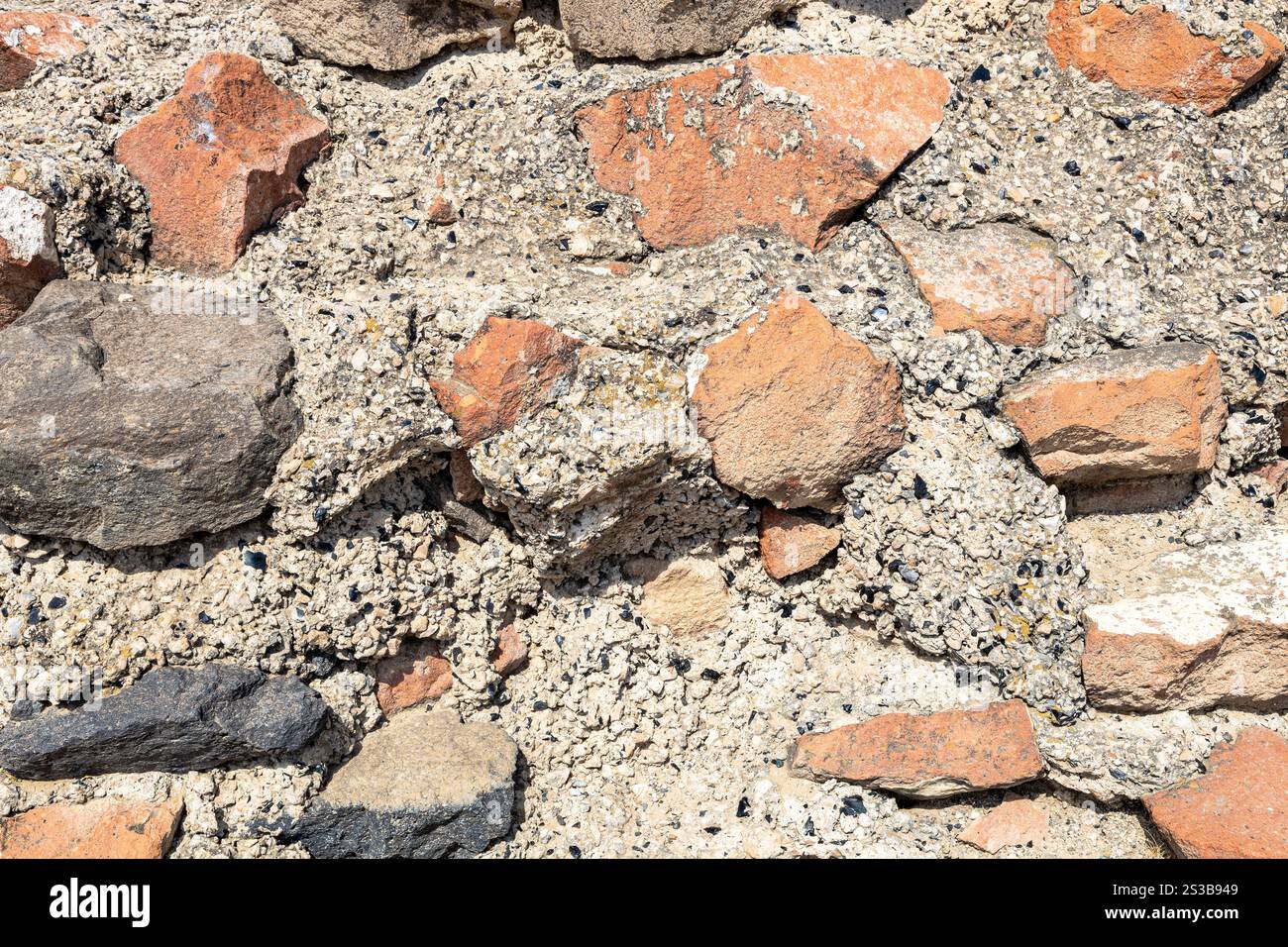 walls of red and black tuff stones bonded with mortar with rubble and ...