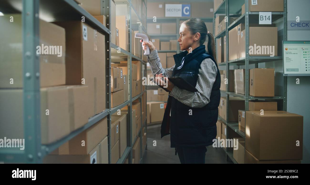 Female Warehouse Associate Scans Cardboard Boxes with E-Commerce Online Goods on Shelves with ...