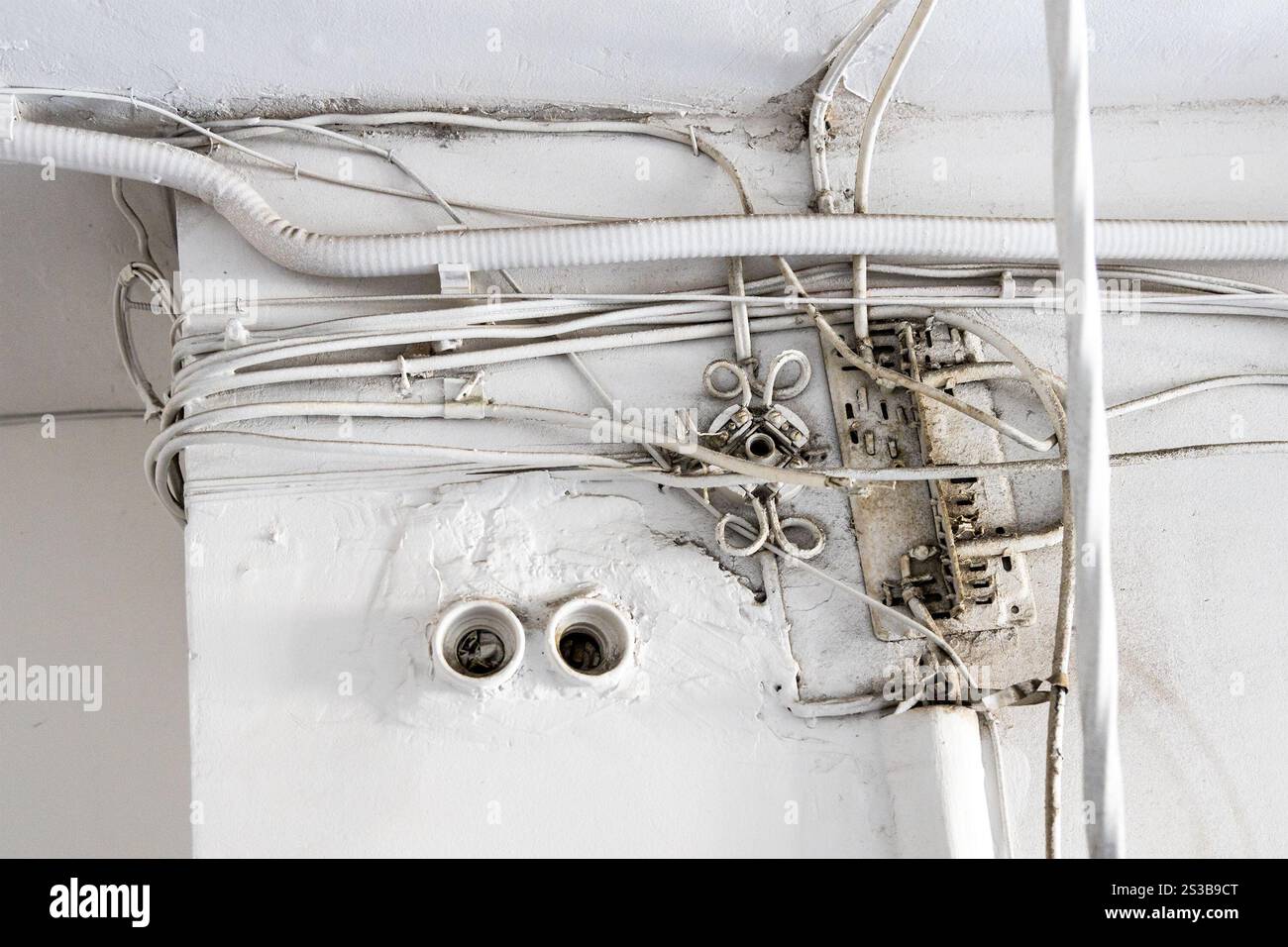tangled electrical wires on wall in hall of residential building Stock ...