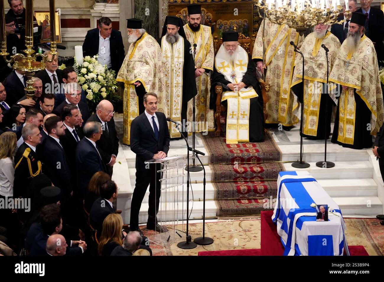 Greece's Prime Minister Kyriakos Mitsotakis delivers a eulogy during ...