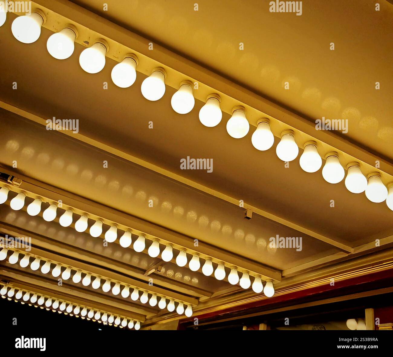 electrician installing or repairing a light, fixing a fluorescent tube ...