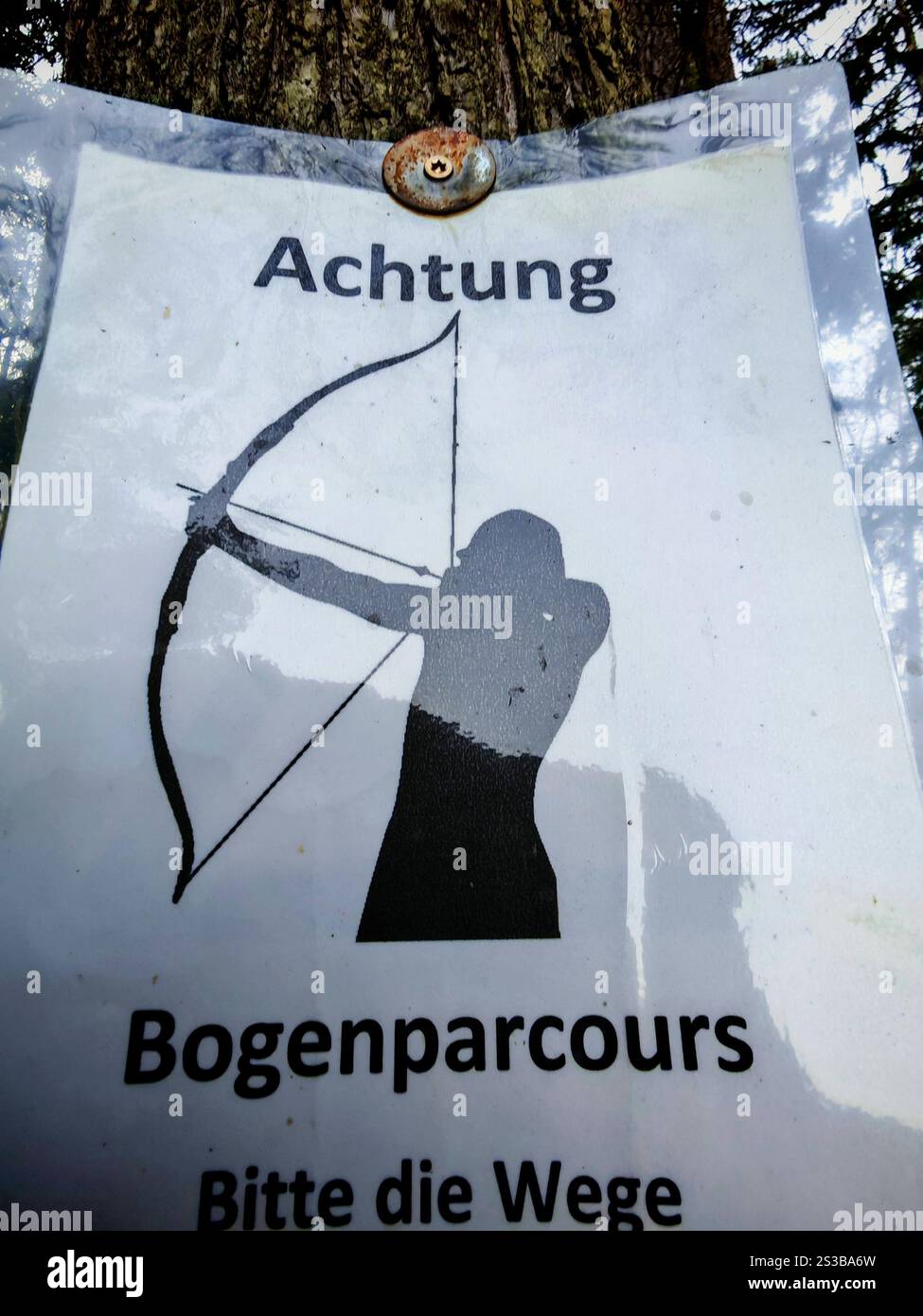 Archer with a bow and arrow aiming in the twilight Archer with bow and ...