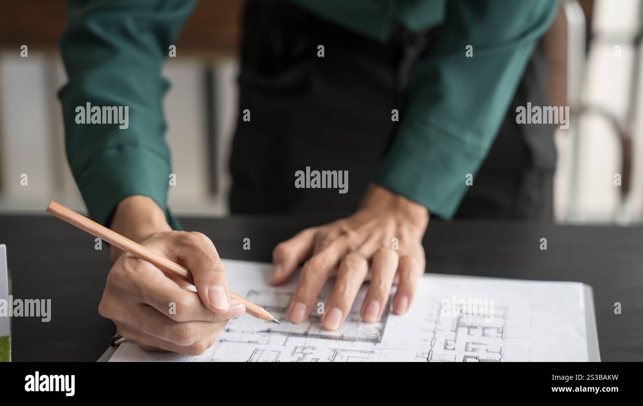 Green Eco Architecture Man drawing on architectural Creative project ...