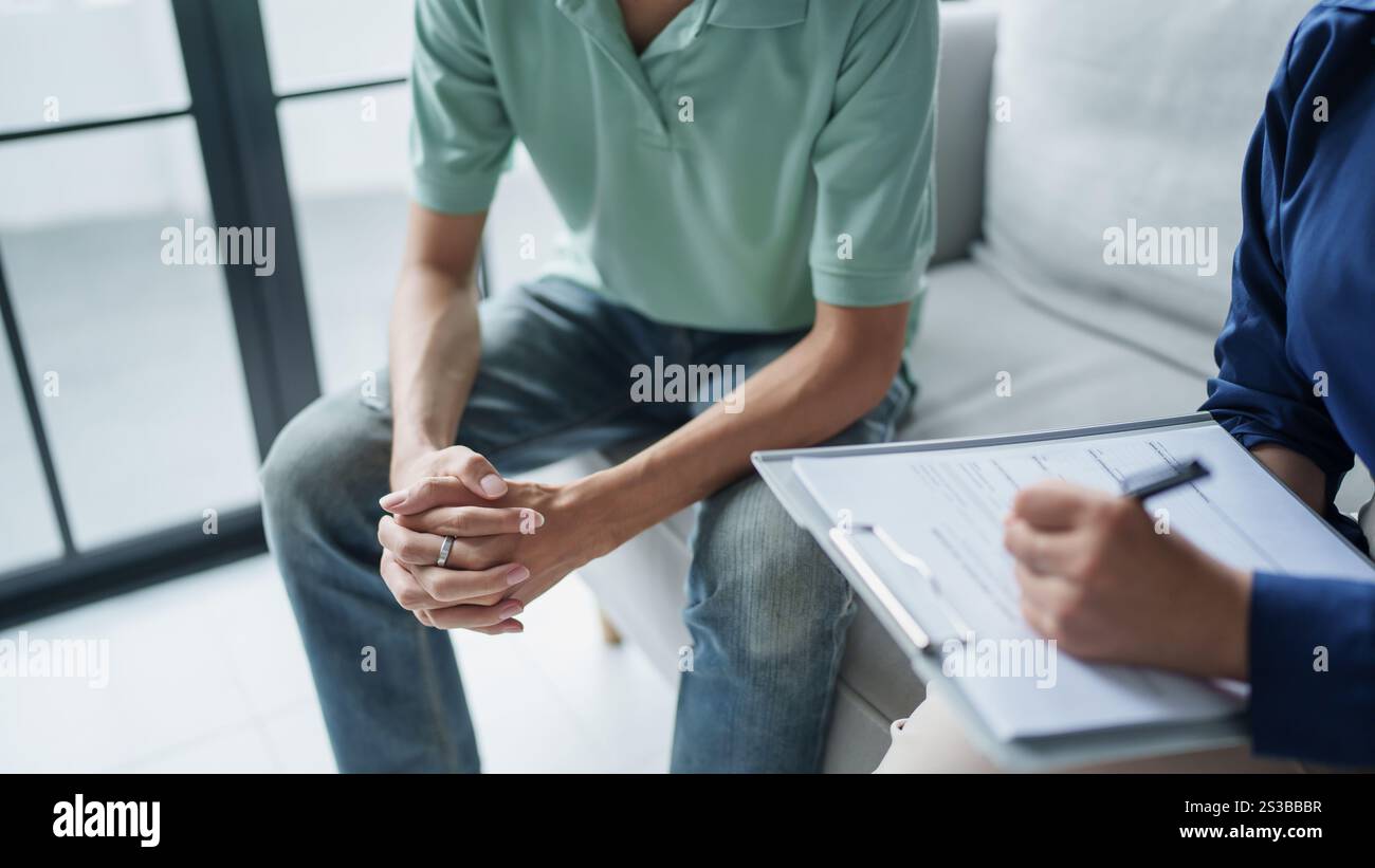 Professional psychotherapy Taking Note During Appointment Patient ...