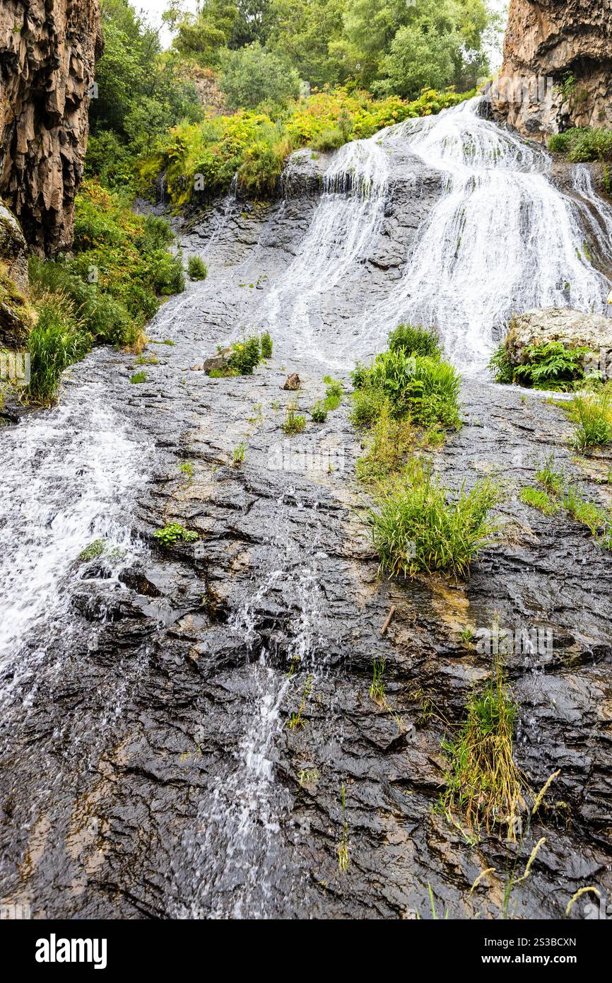 water flow in Jermuk Waterfall in Arpa river gorge on rainy summer day ...