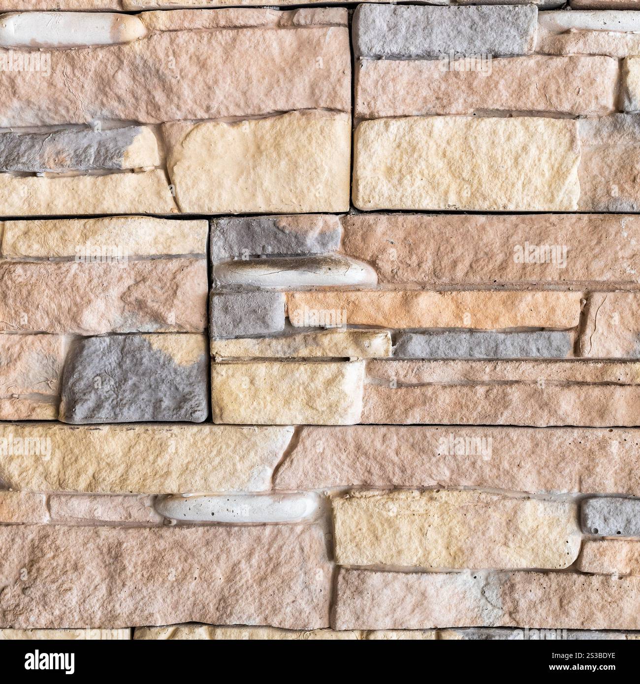 part of wall from colored wild stones and river cobblestones in ...