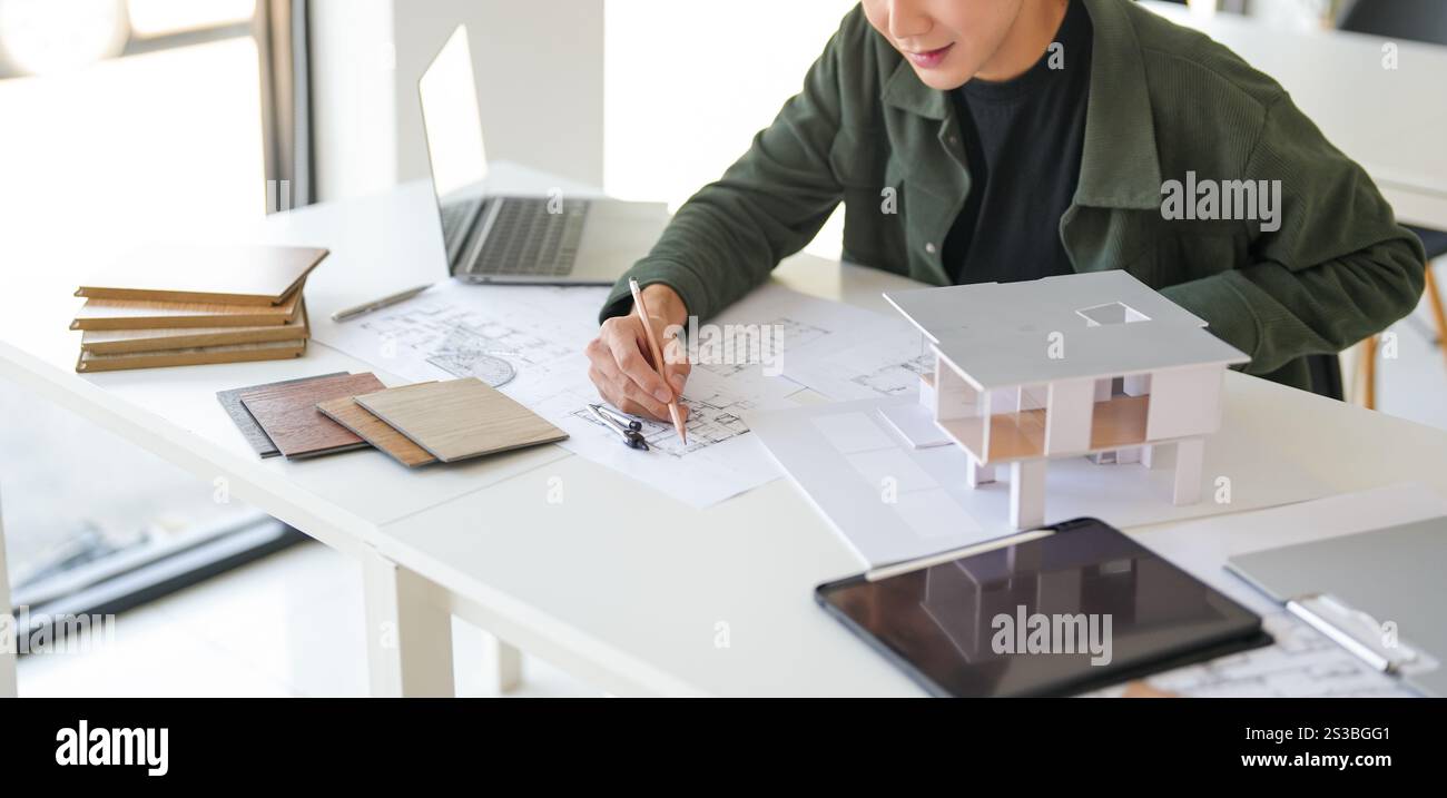 Architecture Man drawing on architectural Creative project business ...