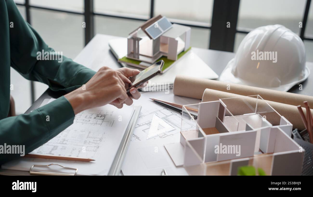 Architecture Man use smart phone for architectural Creative project ...