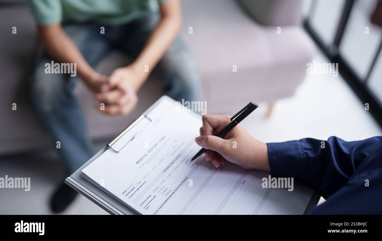 Professional psychotherapy Taking Note During Appointment Patient ...