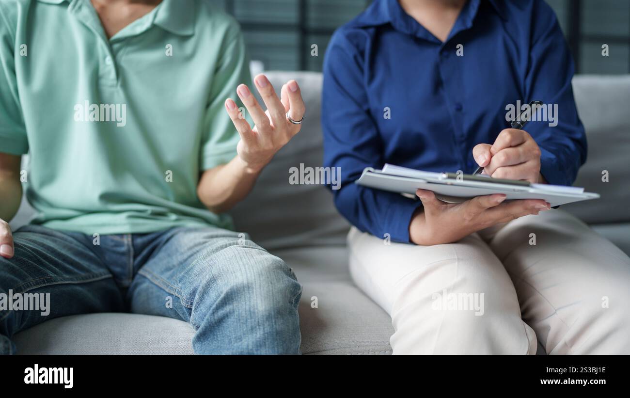 Professional psychotherapy Taking Note During Appointment Patient ...