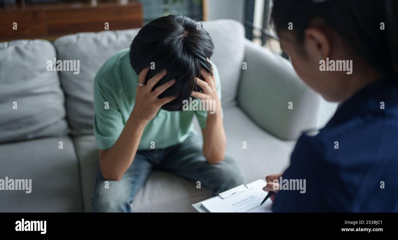 Professional psychotherapy Taking Note During Appointment Patient ...