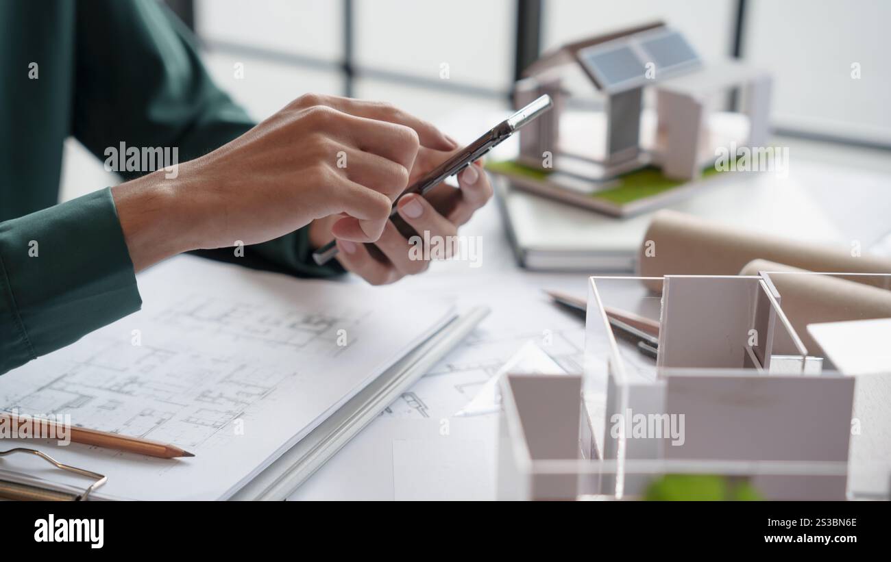 Architecture Man use smart phone for architectural Creative project ...