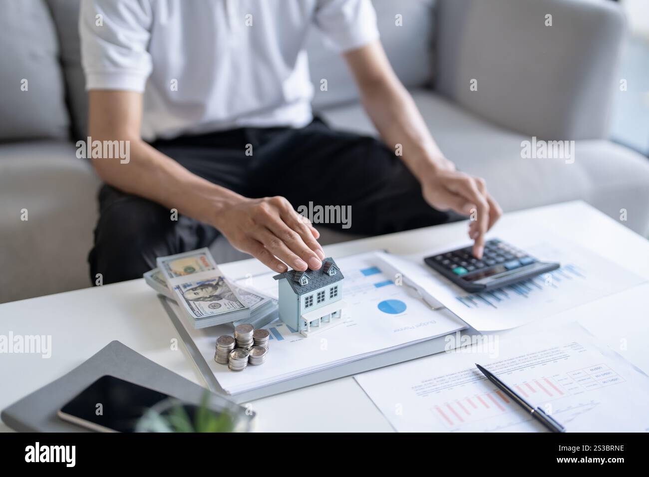 Saving money. Man calculate finances home pay bills taxes savings ...