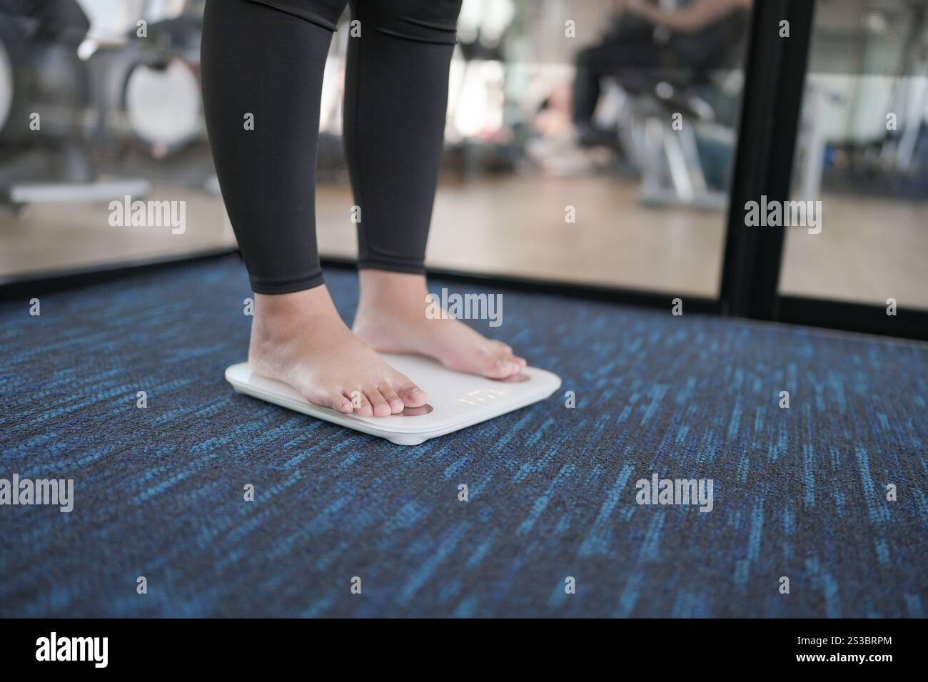 Fat diet and scale feet standing on electronic scales for weight ...