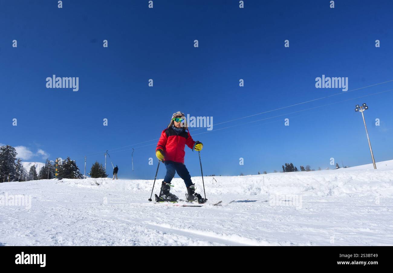 Baramullah, India. 08th Jan, 2025. A small Skier ski after a training ...