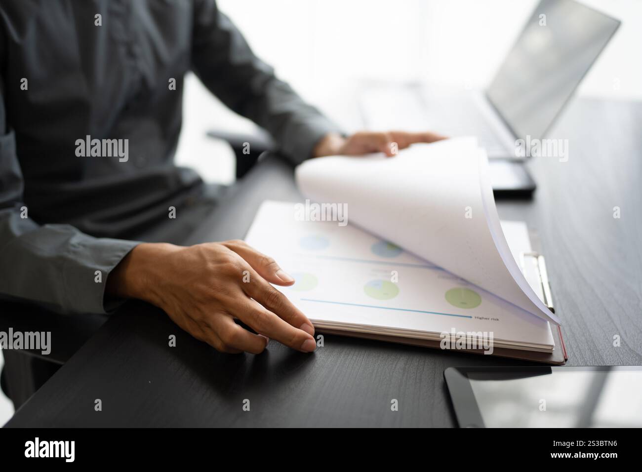 Asian business man holding paper document calculating tax insurance ...