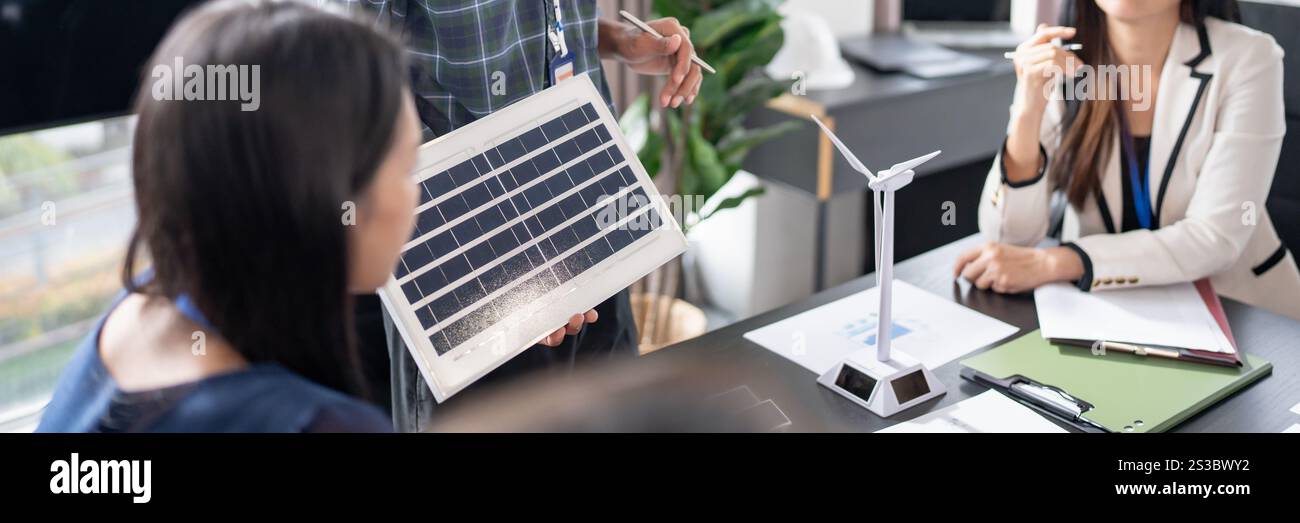 Solar panels green energy Business people working in green eco friendly office business meeting ...