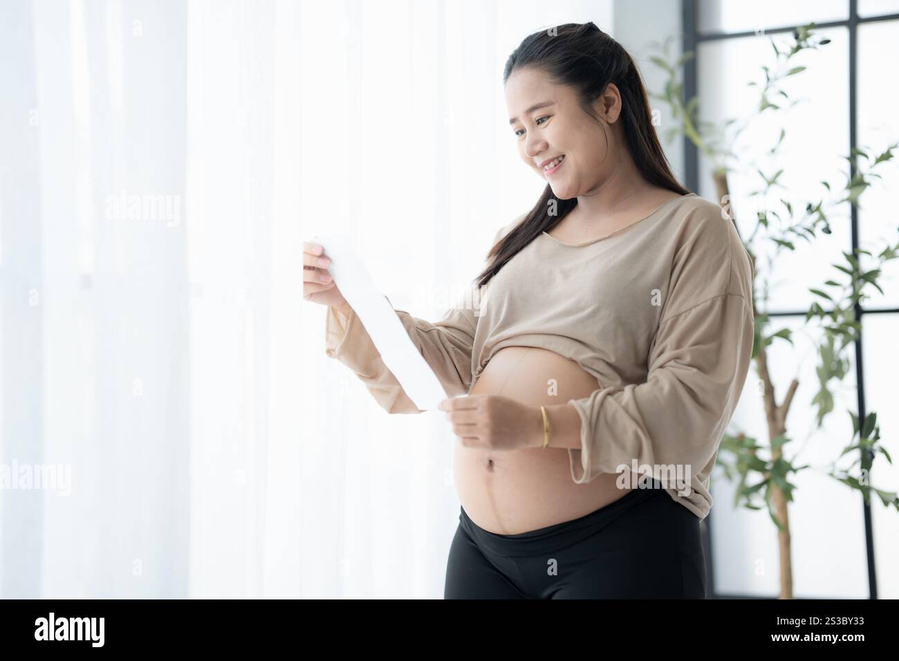 Pregnant asian woman holding ultrasound baby Image Result from Doctor ...