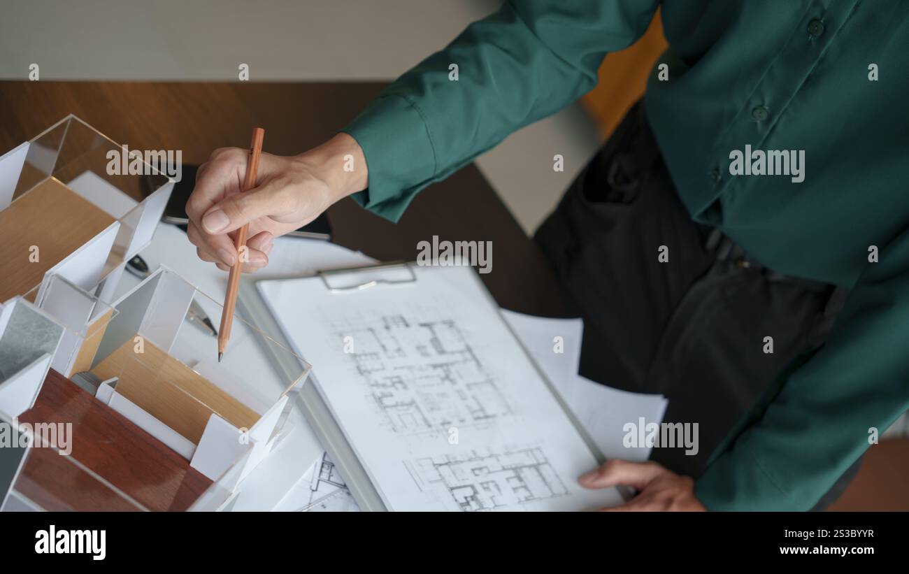 Architecture Man drawing on architectural Creative project business ...