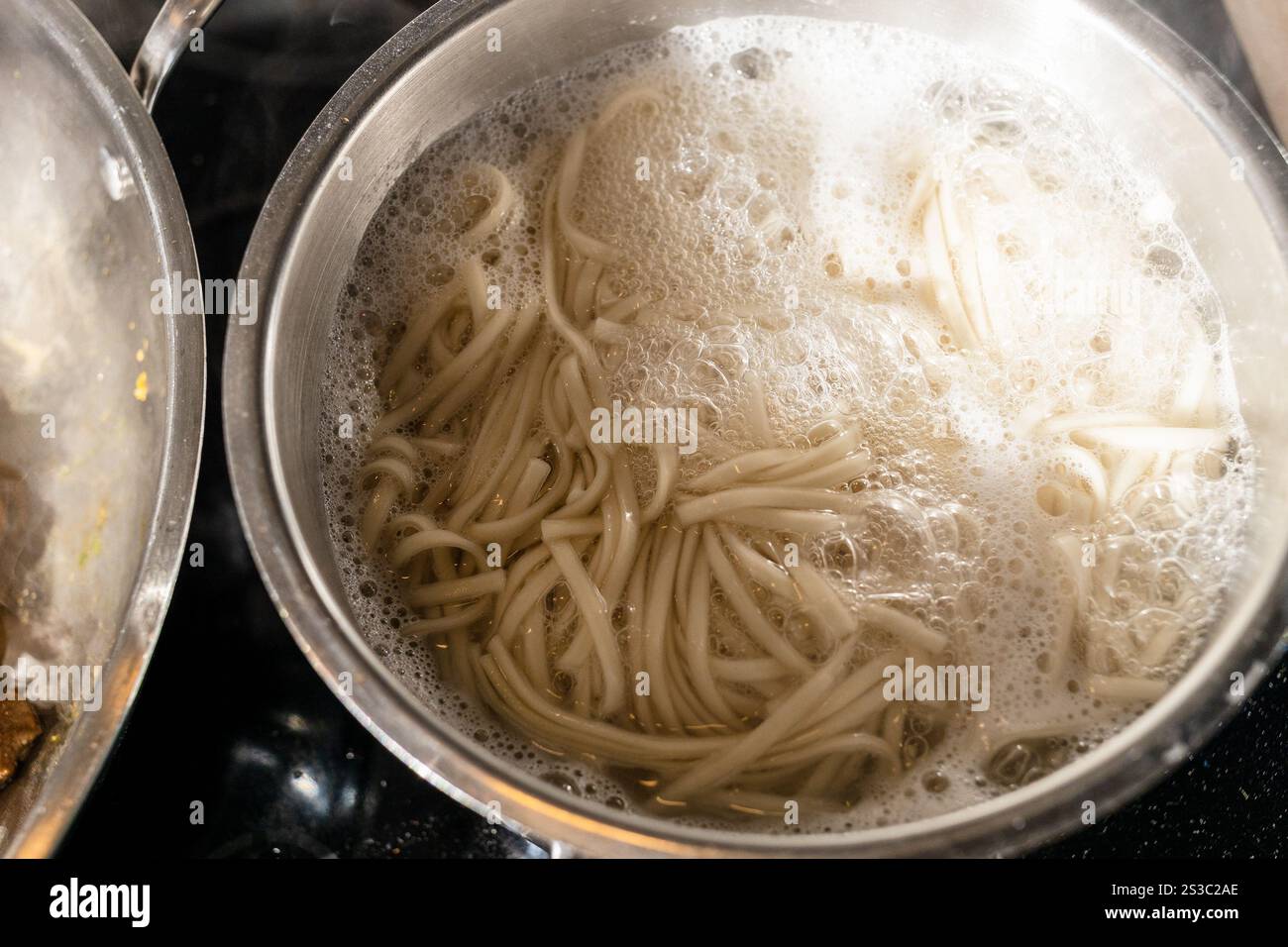 Boiling ramen noodles in pot hi-res stock photography and images - Alamy
