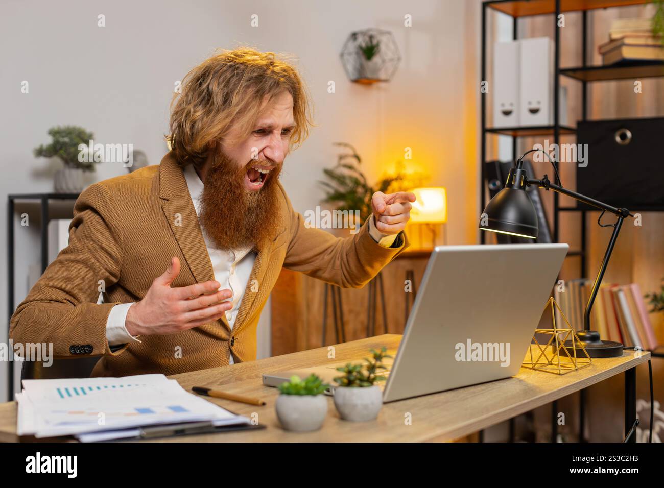 Upset businessman arguing on laptop call online, displaying report ...