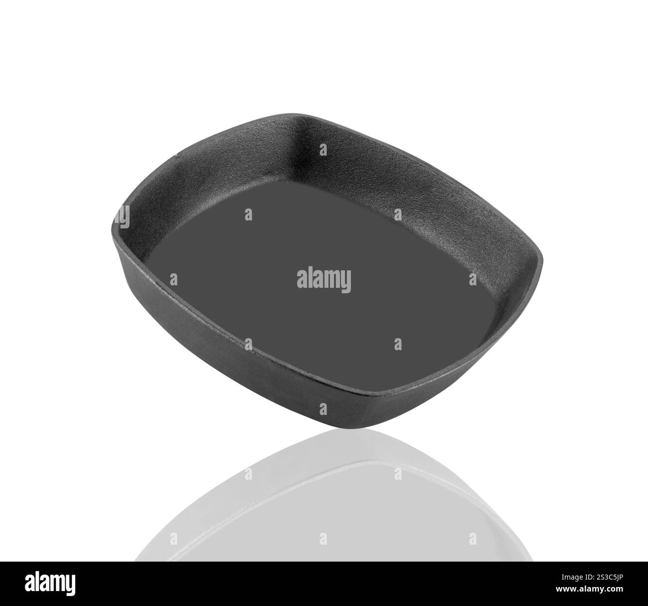 Iron frying pan isolated on white background Stock Photo - Alamy