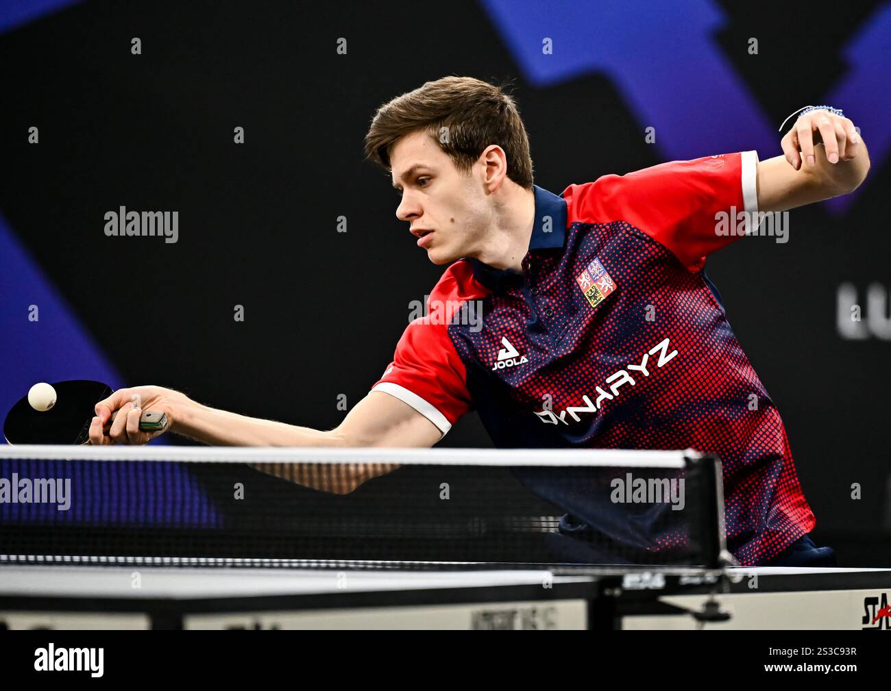 Doha, Qatar. 9th Jan, 2025. Tomas Polansky of the Czech Republic hits a ...