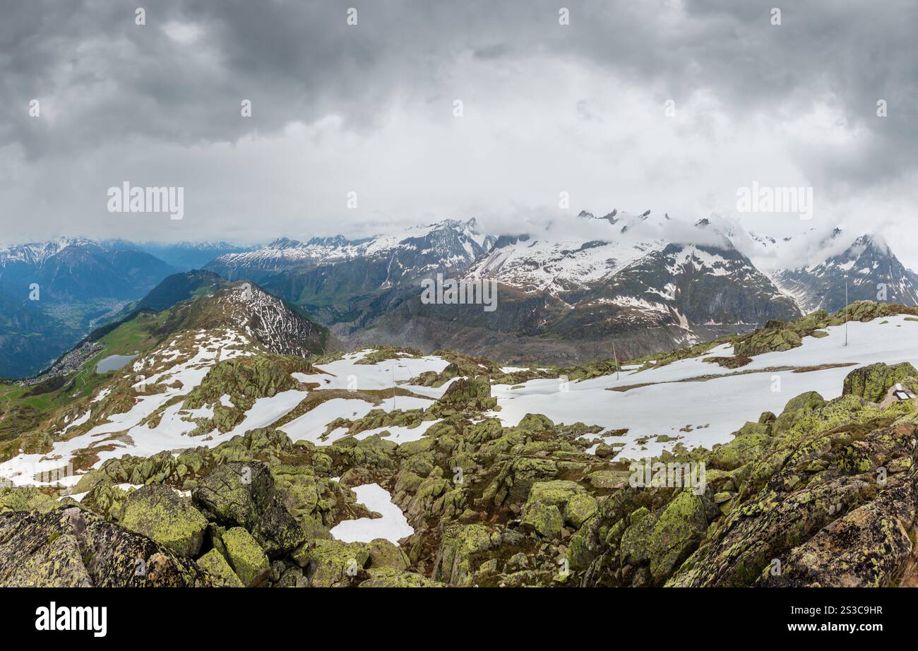 Summer cloudy Alps mountain valley and Bettmeralp village view from ...
