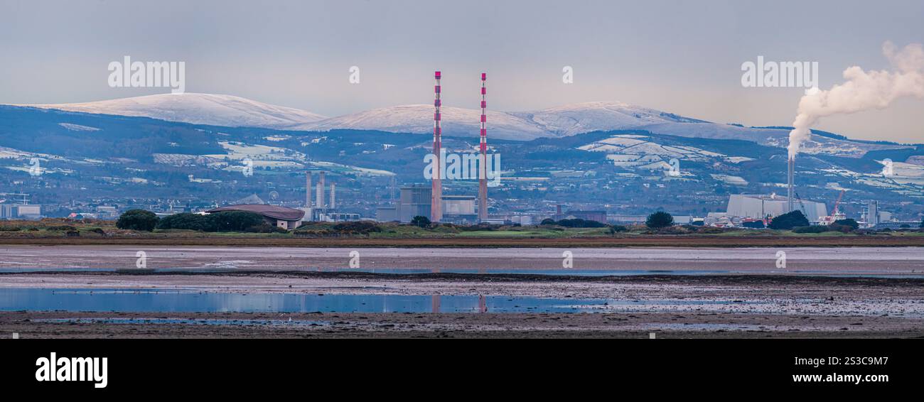 Dublin Mountains with a coating of frost behind the Poolbeg Chimneys ...