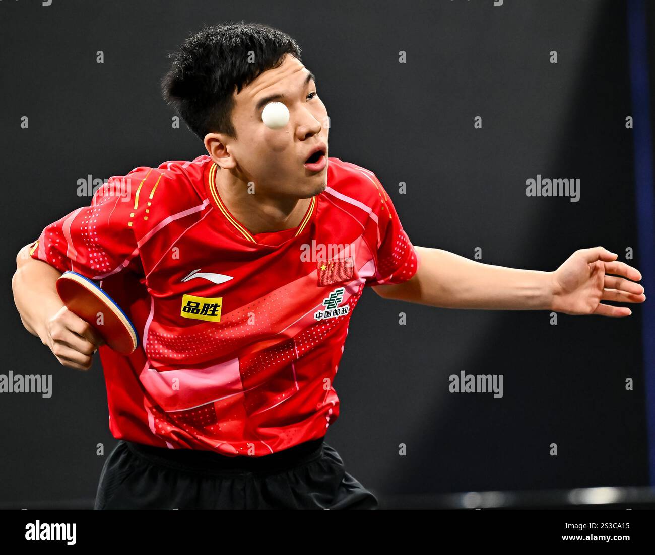 Doha, Qatar. 9th Jan, 2025. Xiang Peng of China serves during the men's ...