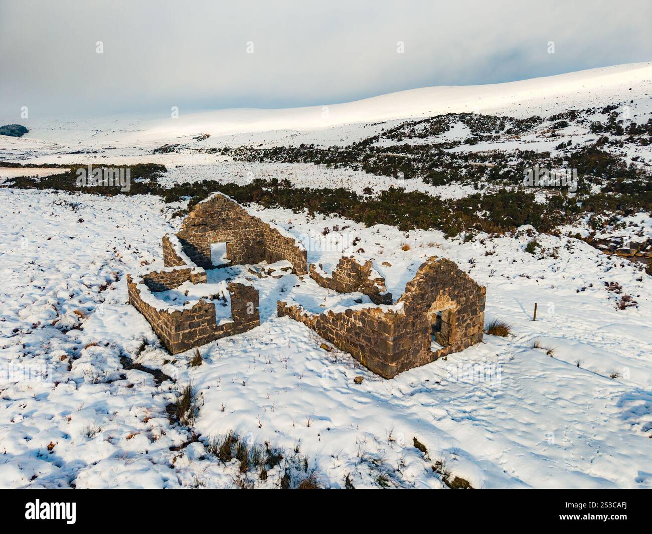 St. Kevin's Bridge abbey ruins in the snow Stock Photo - Alamy