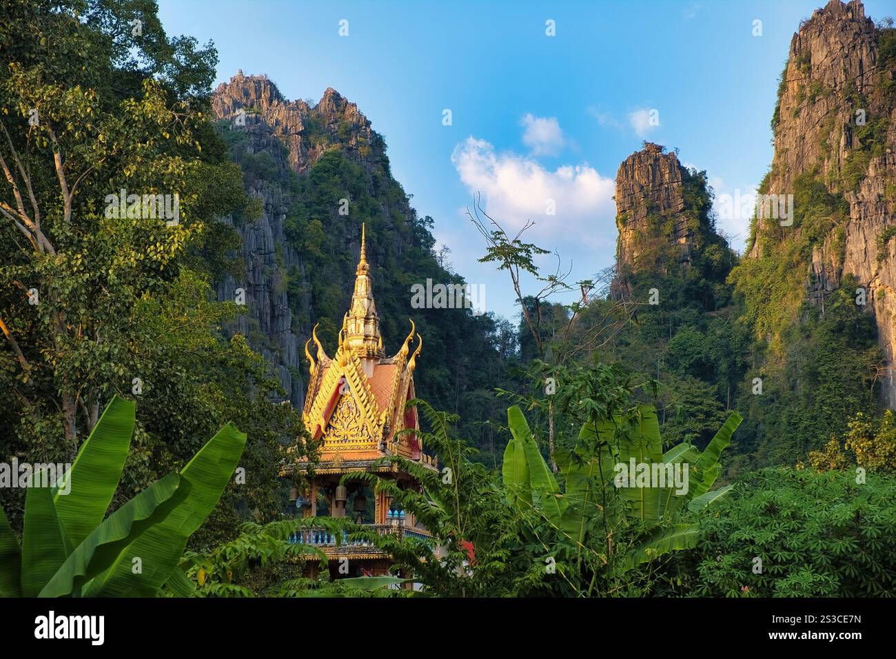 The golden clock tower of Wat Ban Mung, province Phitsanulok, Thailand ...