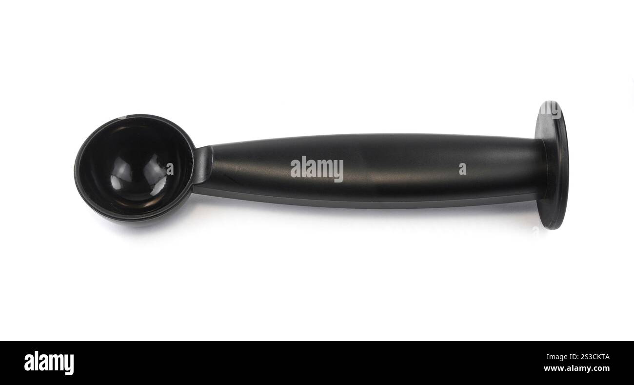 Plastic spoon and tamper for coffee machine. Isolated on the white ...