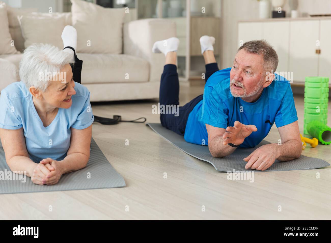 Fitness training. Senior mature healthy fit couple doing sports ...