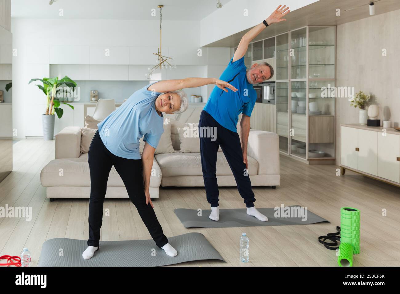 Fitness training. Senior mature healthy fit couple doing sports ...