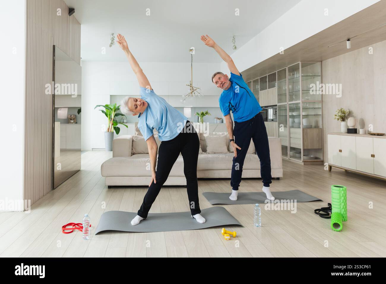 Fitness training. Senior mature healthy fit couple doing sports ...