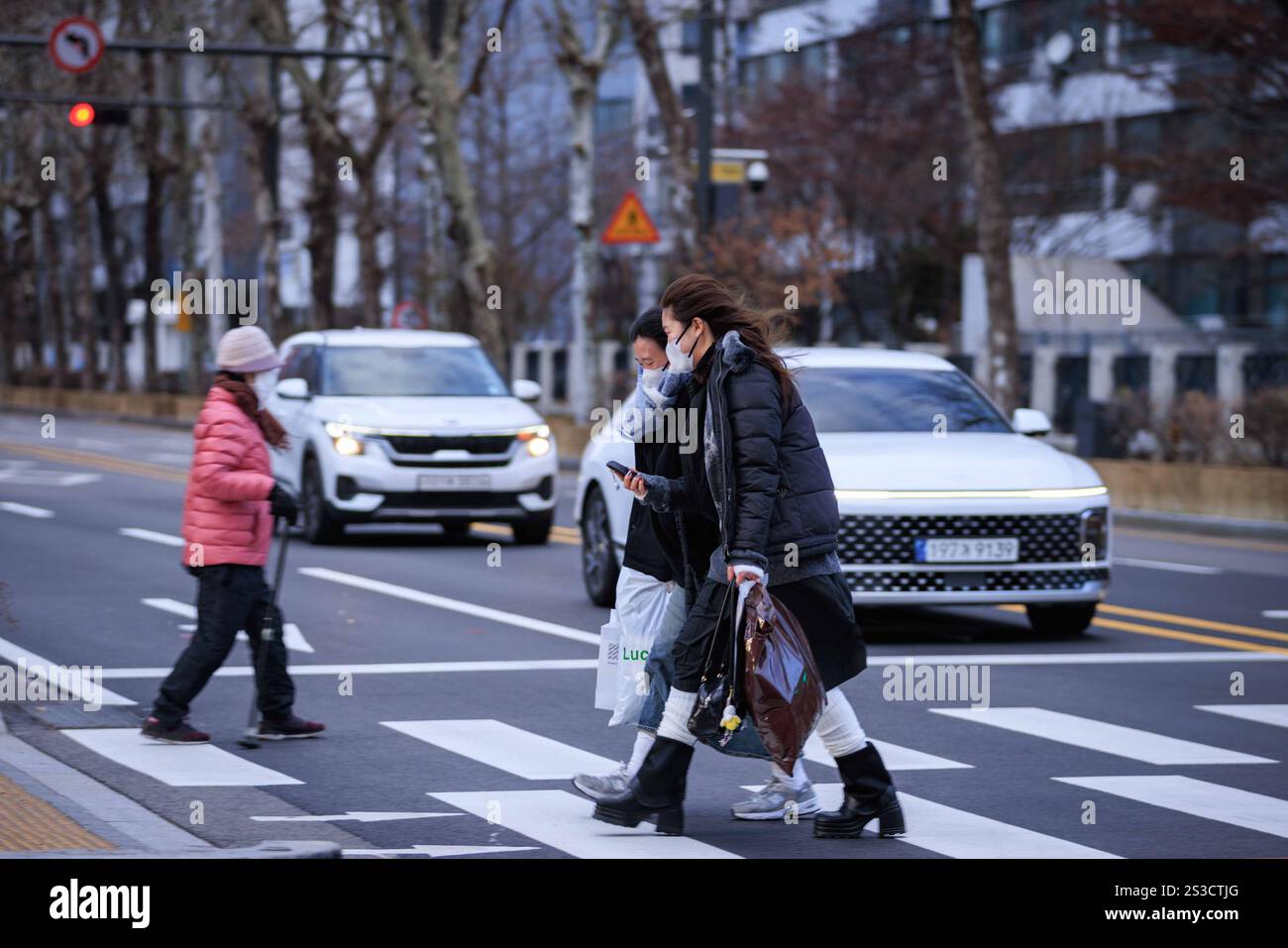Seoul, South Korea. 9th Jan, 2025. People walk on a street in Seoul ...