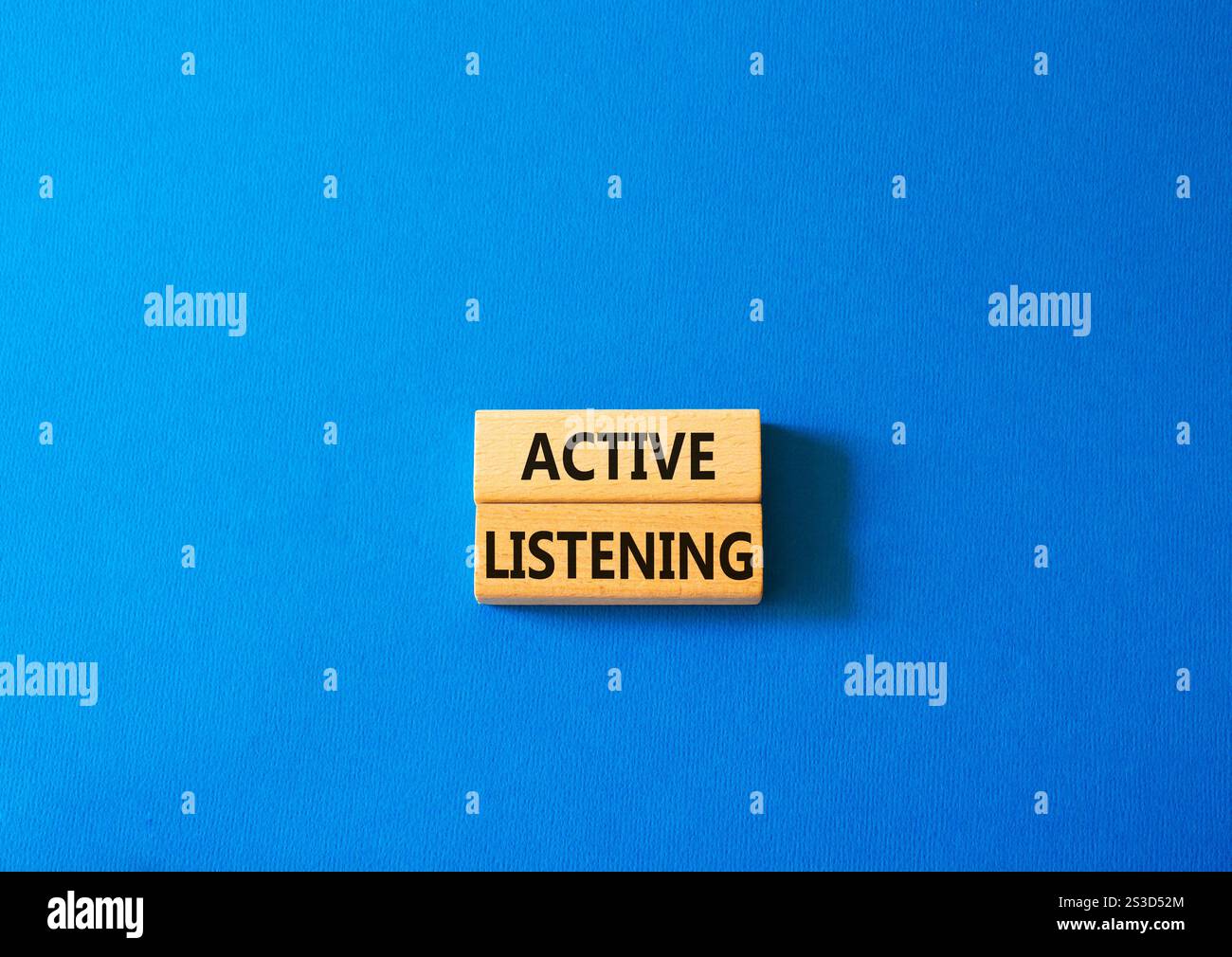 Active listening symbol. Wooden blocks with words Active listening ...
