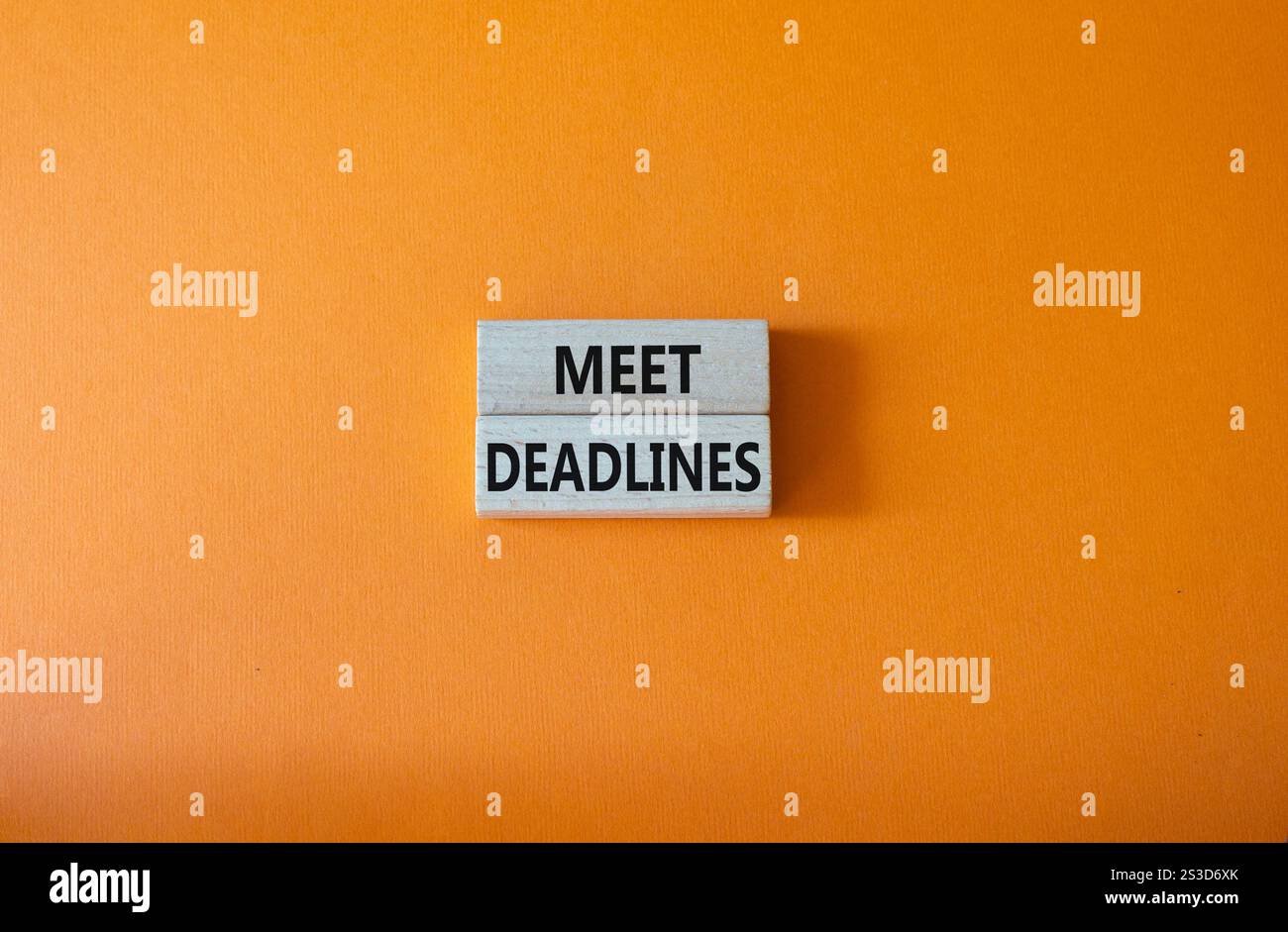 Meet Deadlines symbol. Concept word Meet Deadlines on wooden blocks ...