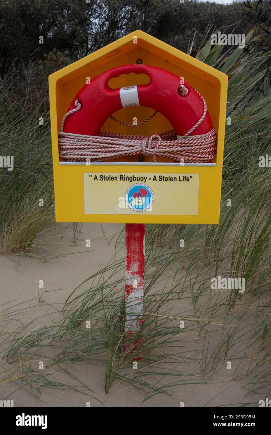 life belt with warning sign on risks and hazards in seafaring and ...