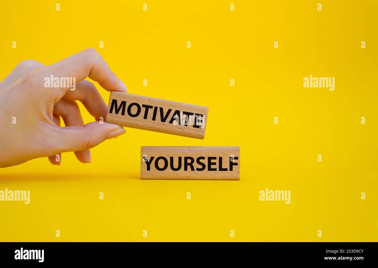 Motivation symbol. Concept words 'Motivate yourself' on wooden blocks ...