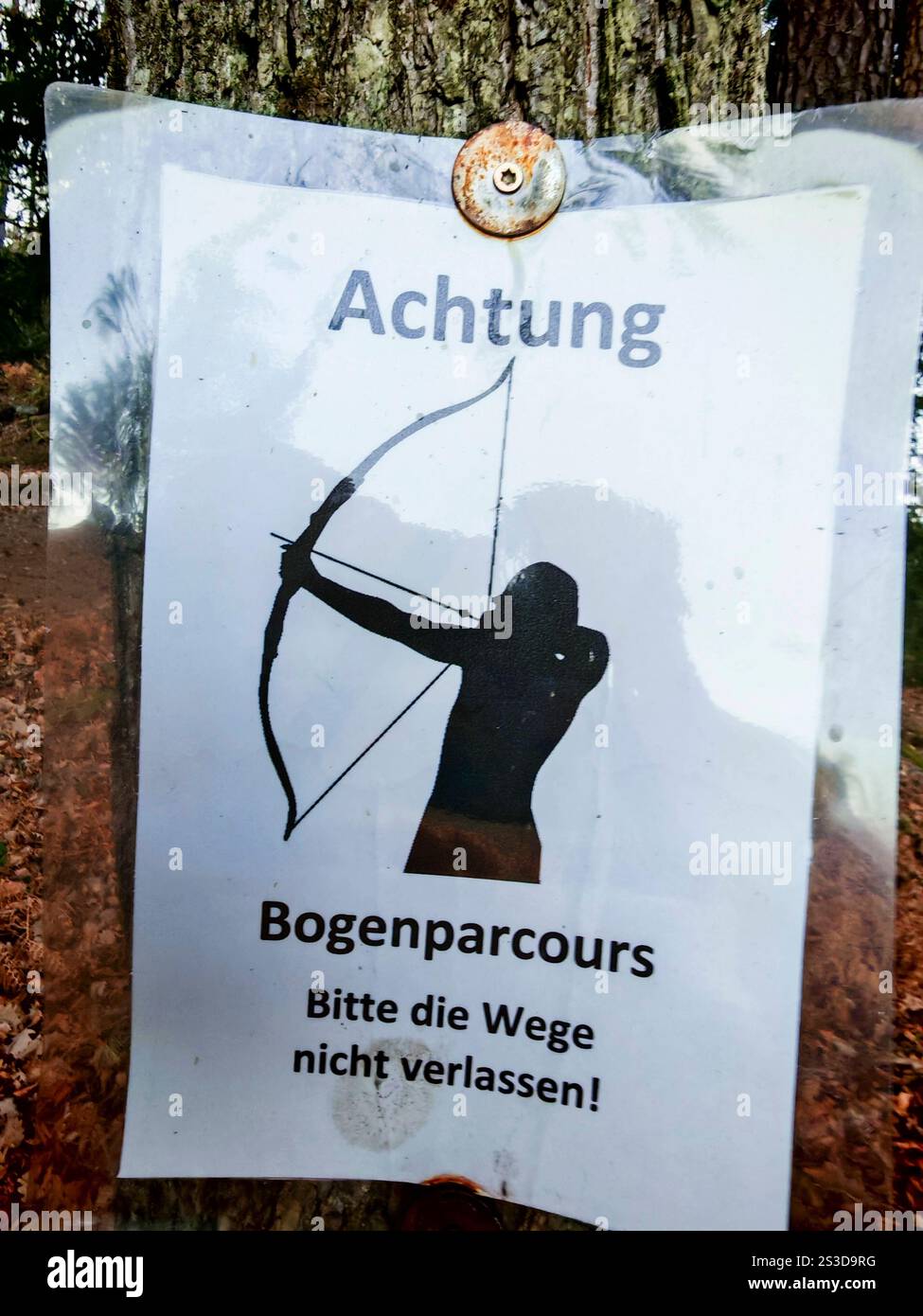 Archer with a bow and arrow aiming in the twilight Archer with bow and ...