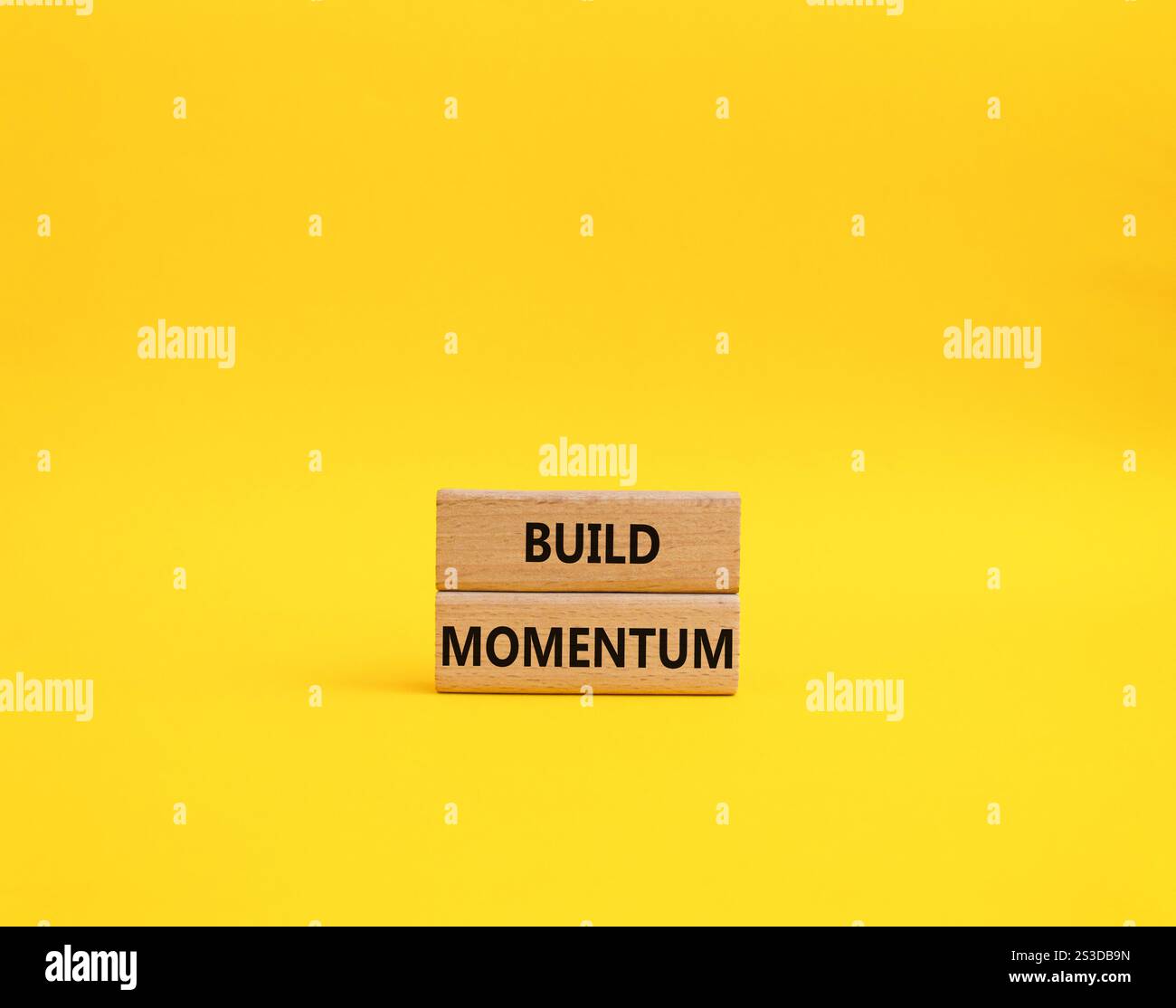 Build momentum symbol. Wooden blocks with words Build momentum ...