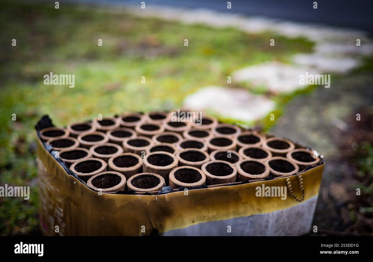 Burnt firecracker leftover after new year eve outdoor in Germany Stock ...