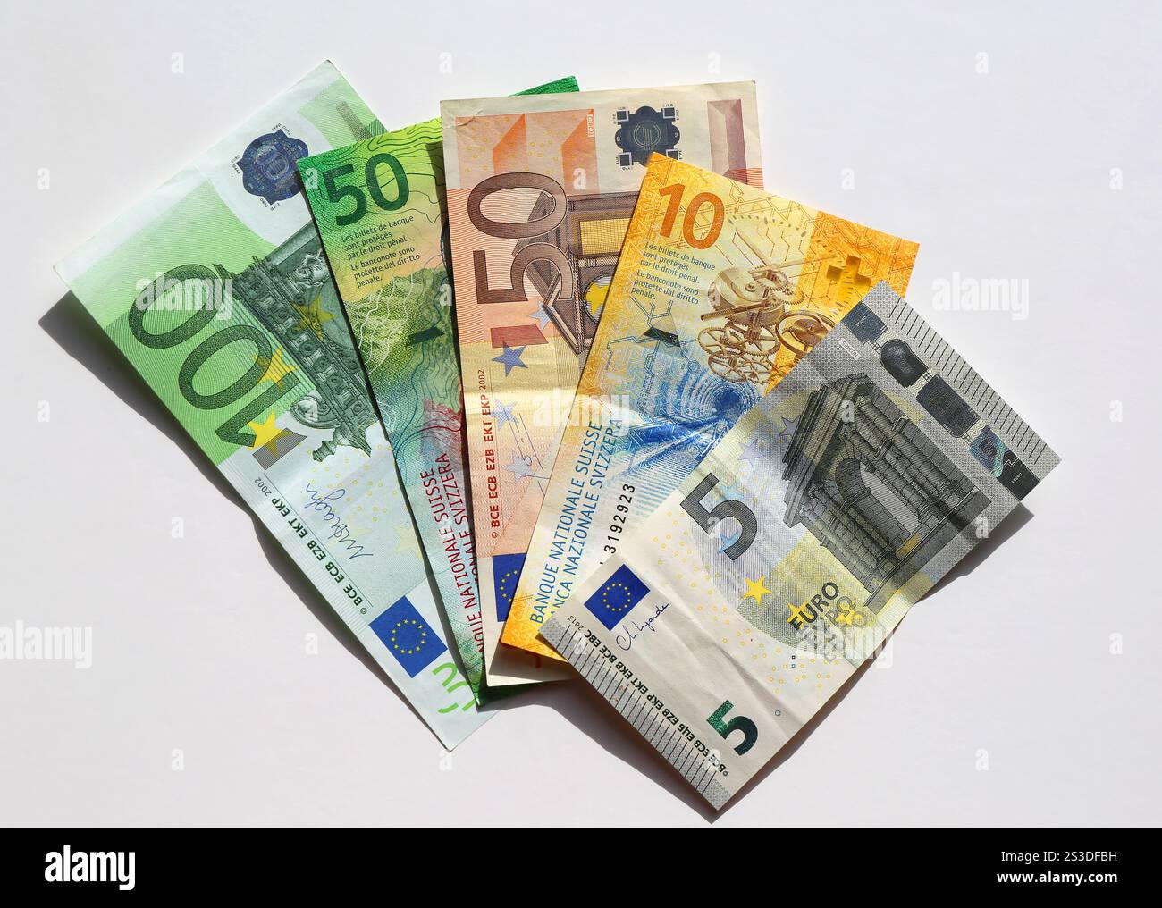 Colorful Euro and Swiss Franc Banknotes isolated on white Stock Photo ...