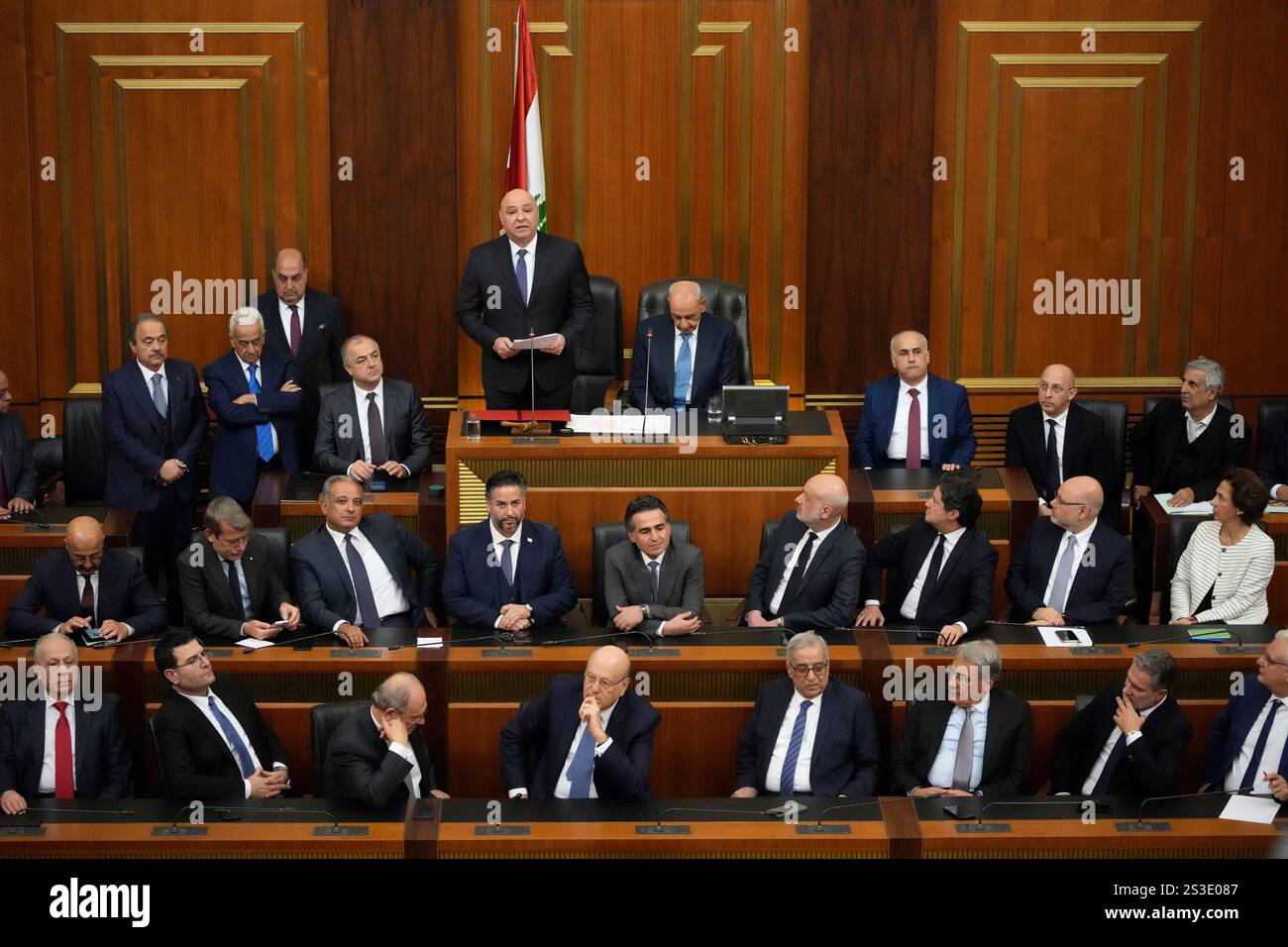 Newly-elected Lebanese President Joseph Aoun, standing at background ...
