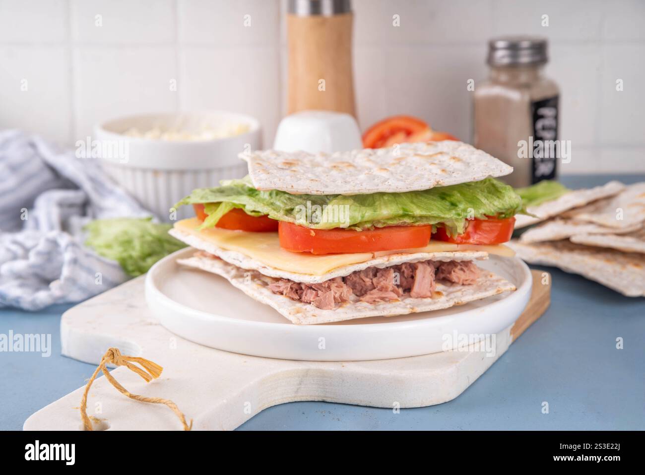 Tasty matzah sandwich with tuna, cheese, lettuce and vegetables. Viral ...