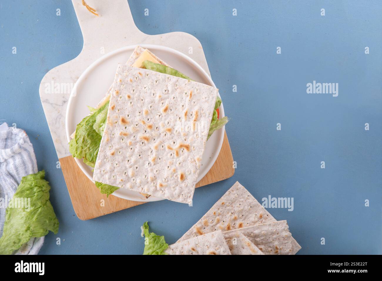 Tasty matzah sandwich with tuna, cheese, lettuce and vegetables. Viral ...