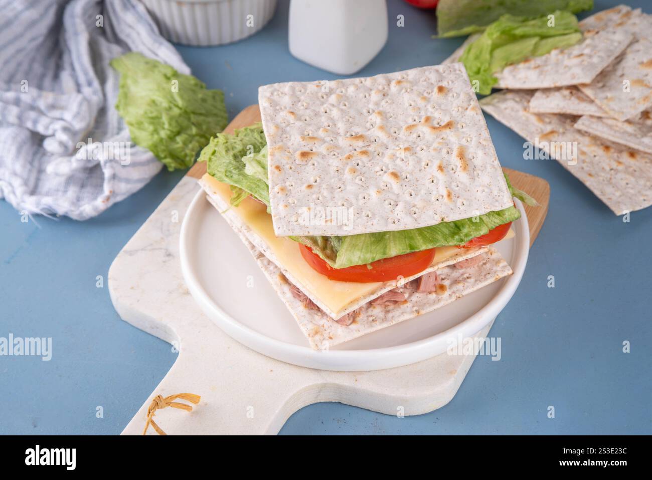 Tasty matzah sandwich with tuna, cheese, lettuce and vegetables. Viral ...