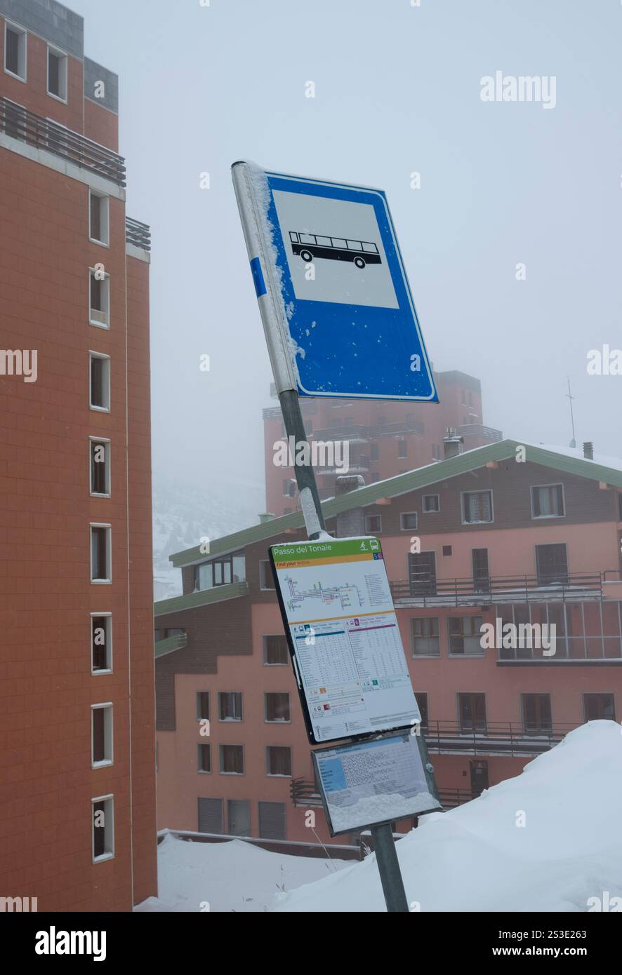 leaning bus stop signpost, Tonale, Trentino, Italy Stock Photo - Alamy